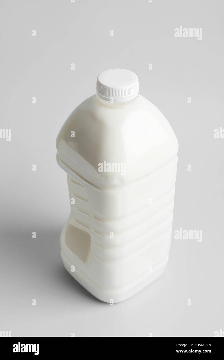 Gallon bottle of milk on light background Stock Photo - Alamy