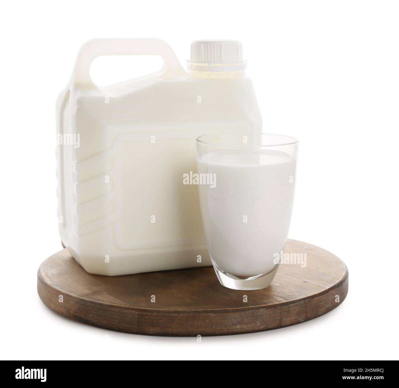 Gallon bottle and glass of milk on white background Stock Photo - Alamy