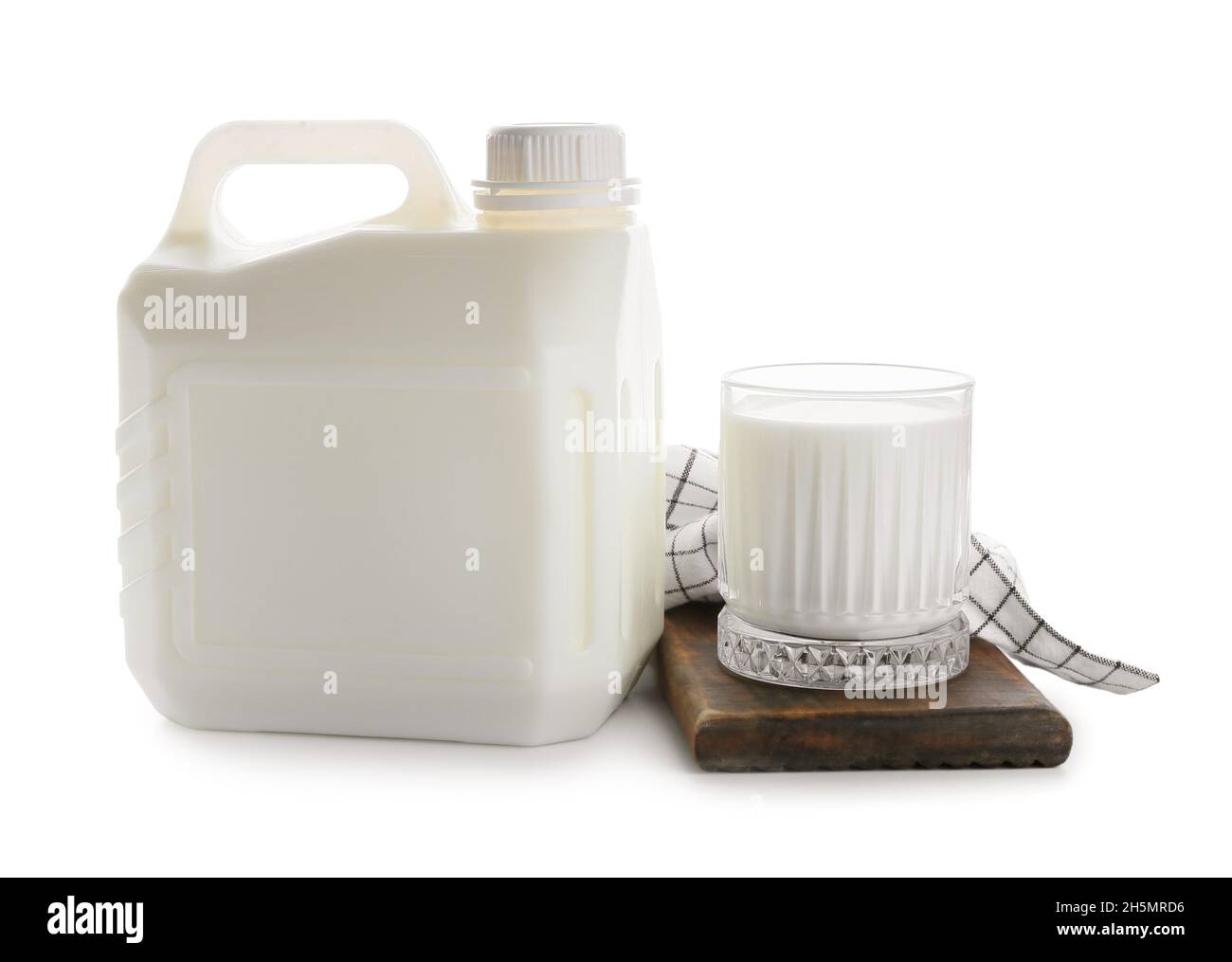 Gallon bottle and glass of milk on white background Stock Photo - Alamy