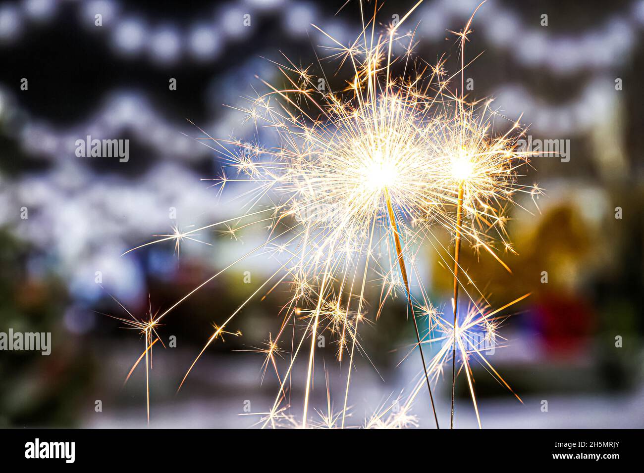 Beautiful burning sparklers at night city Stock Photo - Alamy