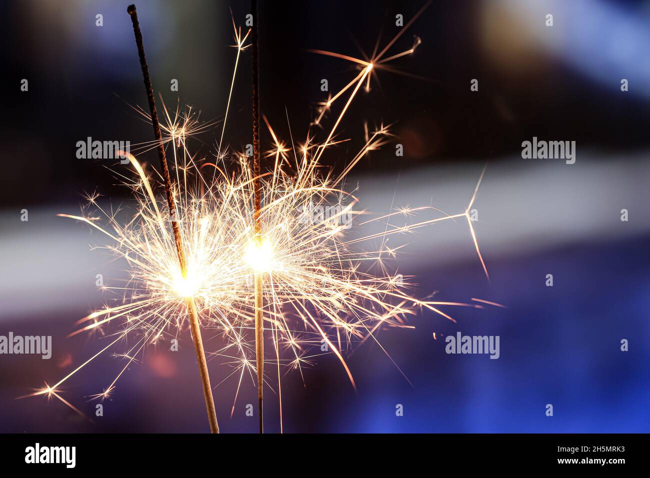 Burning sparklers at night city Stock Photo - Alamy