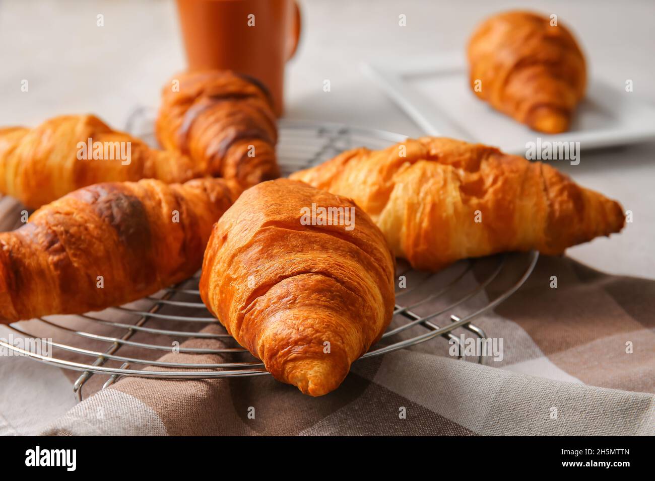 Grid with delicious croissants on white background Stock Photo - Alamy