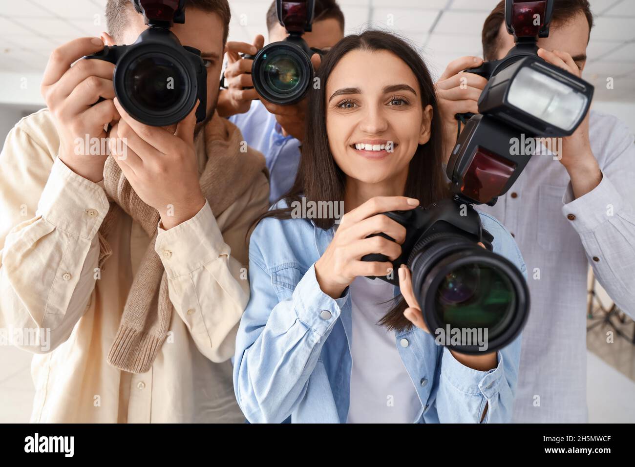 Group of photographers during classes in studio Stock Photo - Alamy