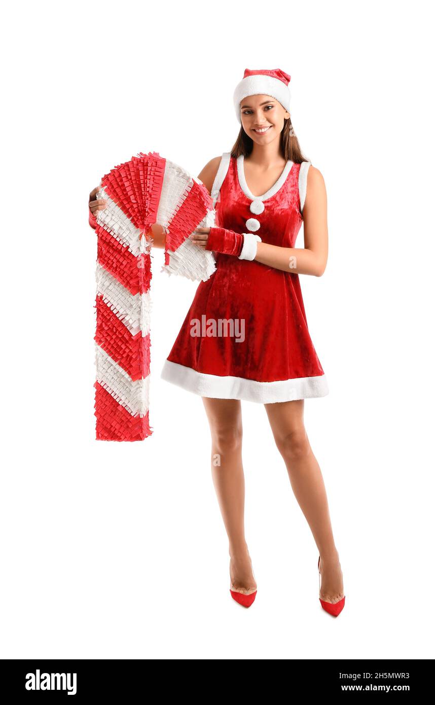 Beautiful woman dressed as Santa with candy cane pinata on white ...