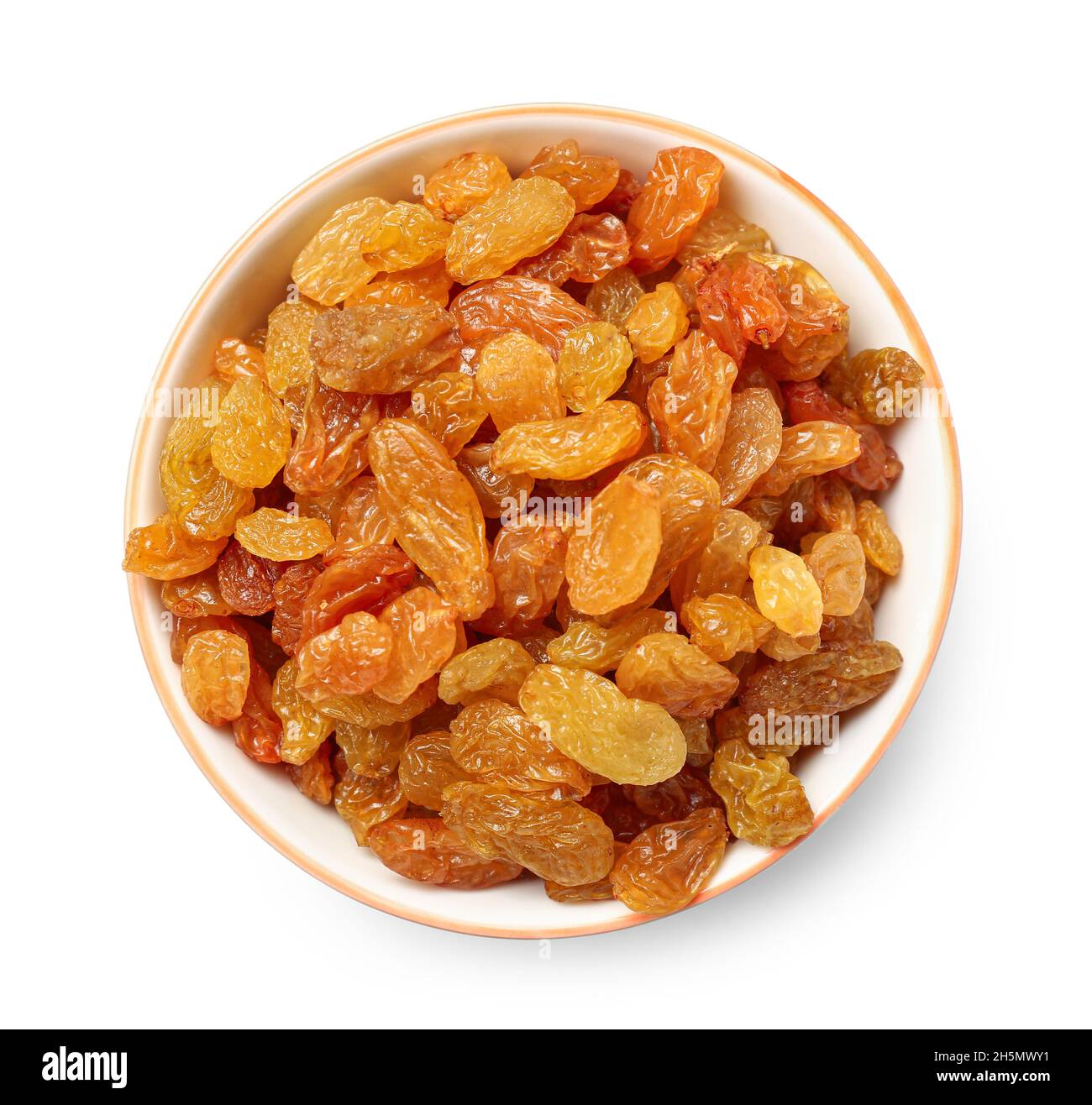 Sweet raisins in bowl on white background Stock Photo - Alamy