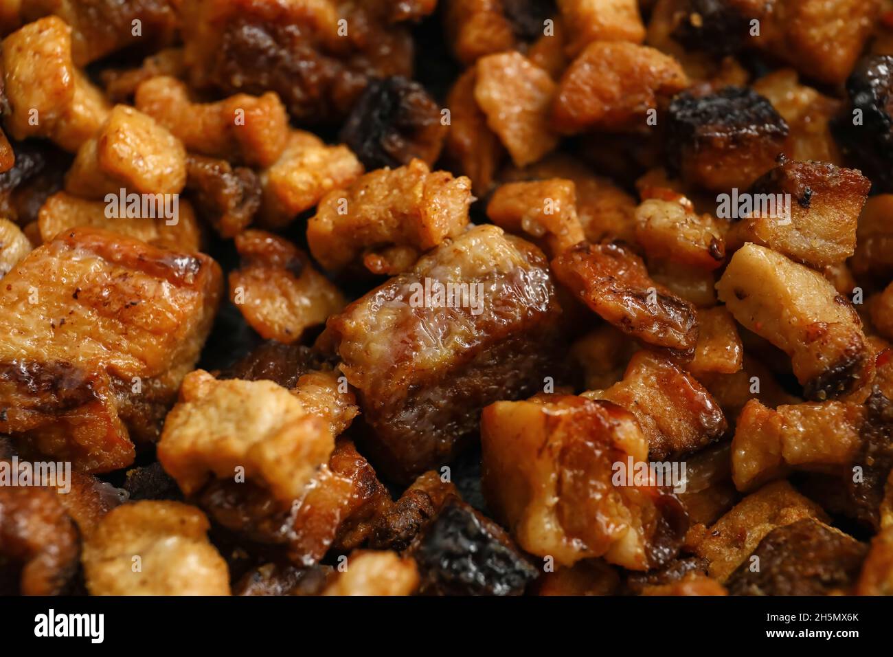 Many tasty cracklings as background Stock Photo - Alamy