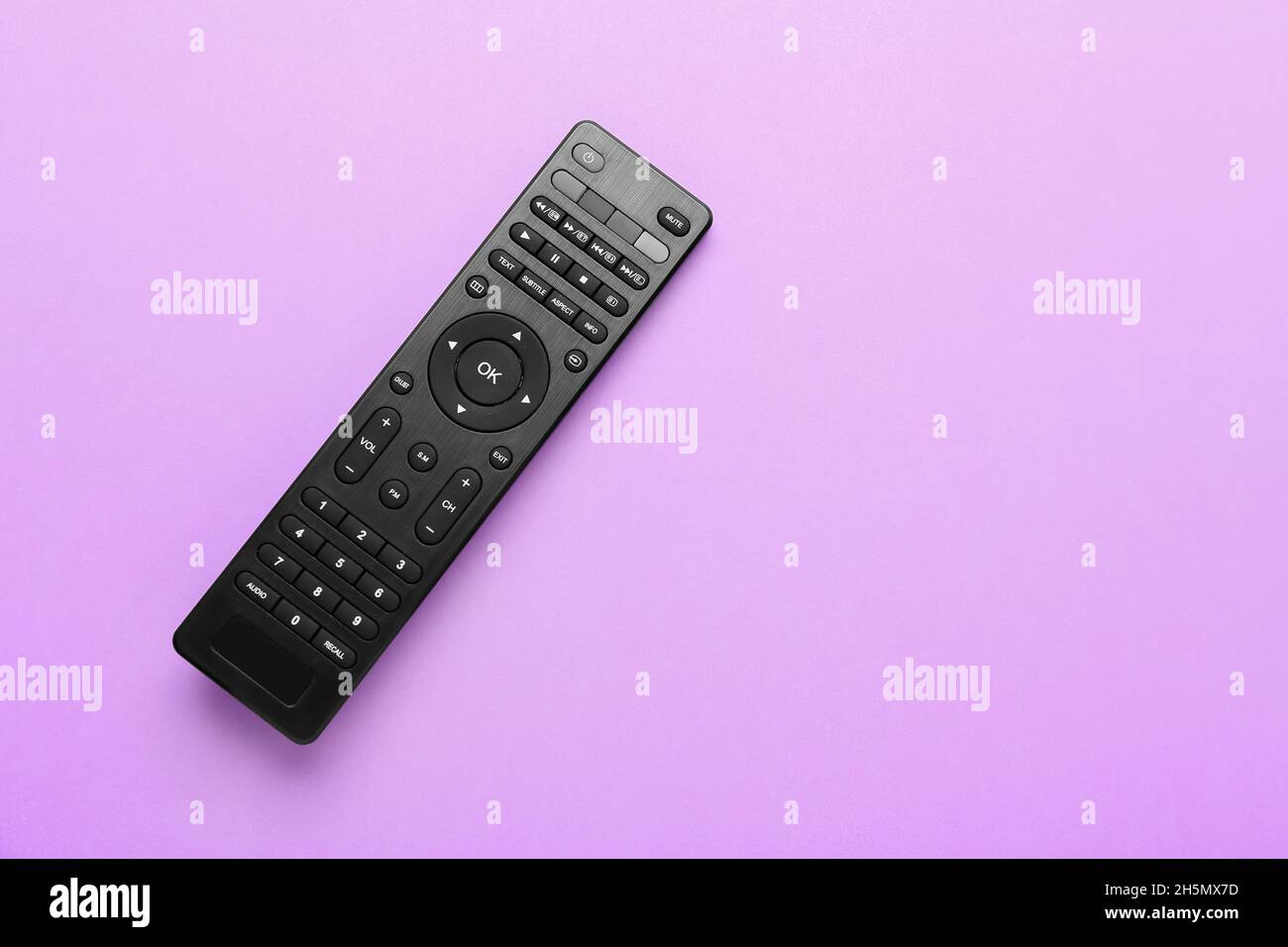 Modern TV remote control on color background Stock Photo - Alamy