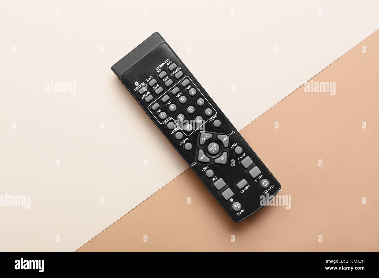 Modern TV remote control on color background Stock Photo - Alamy