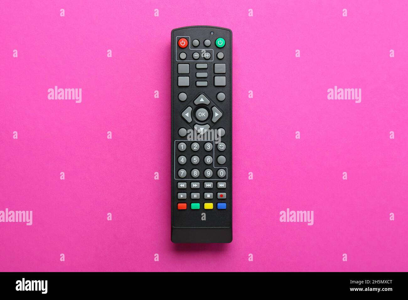 Modern TV remote control on pink background Stock Photo - Alamy