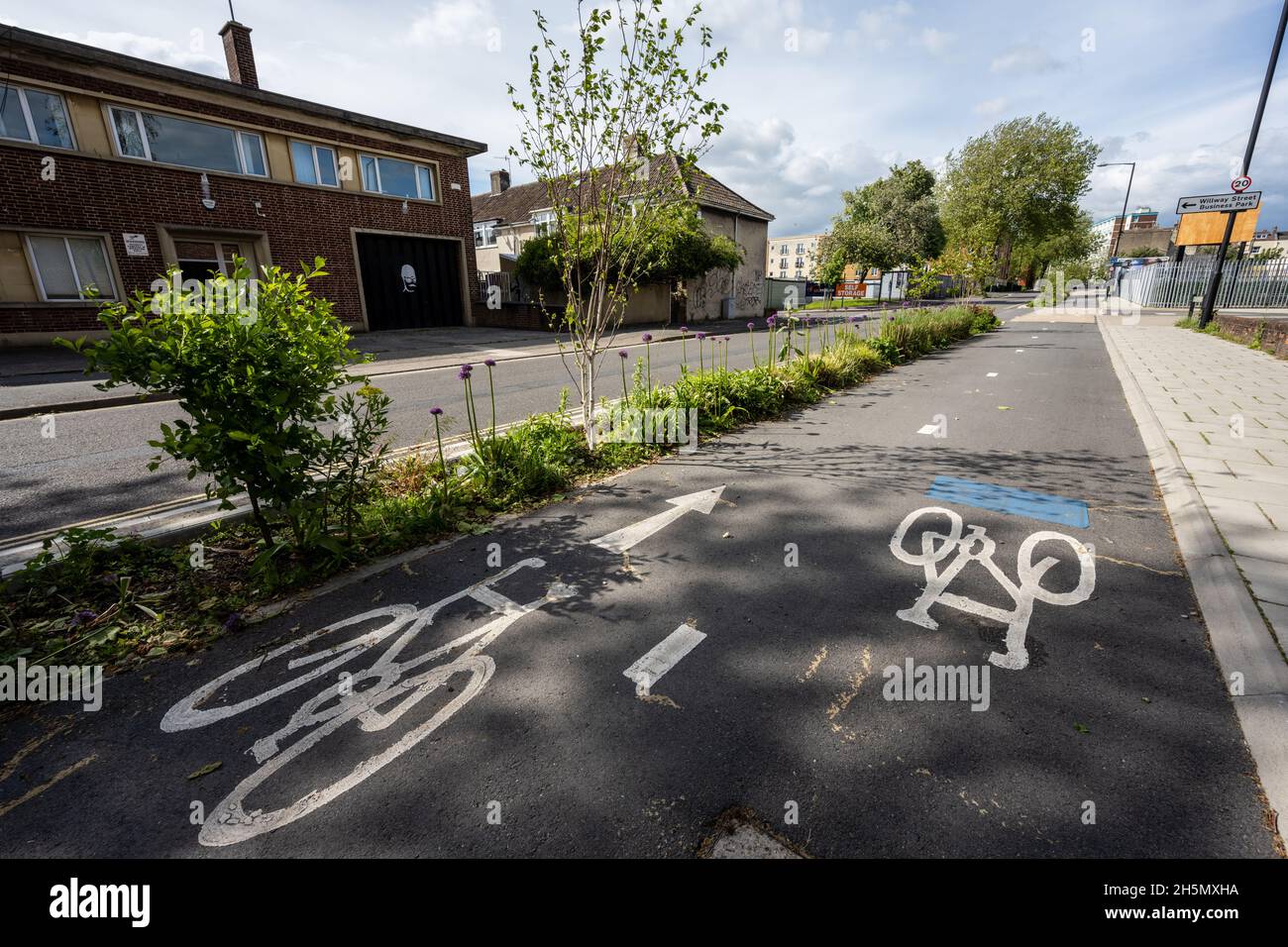 A segregated cycle track is protected from traffic by a sustainable ...