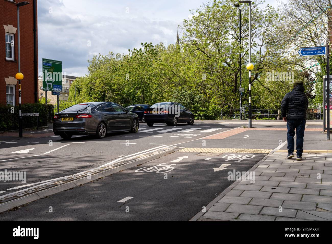 A bidirectional protected cycle track and parallel zebra crossing form ...