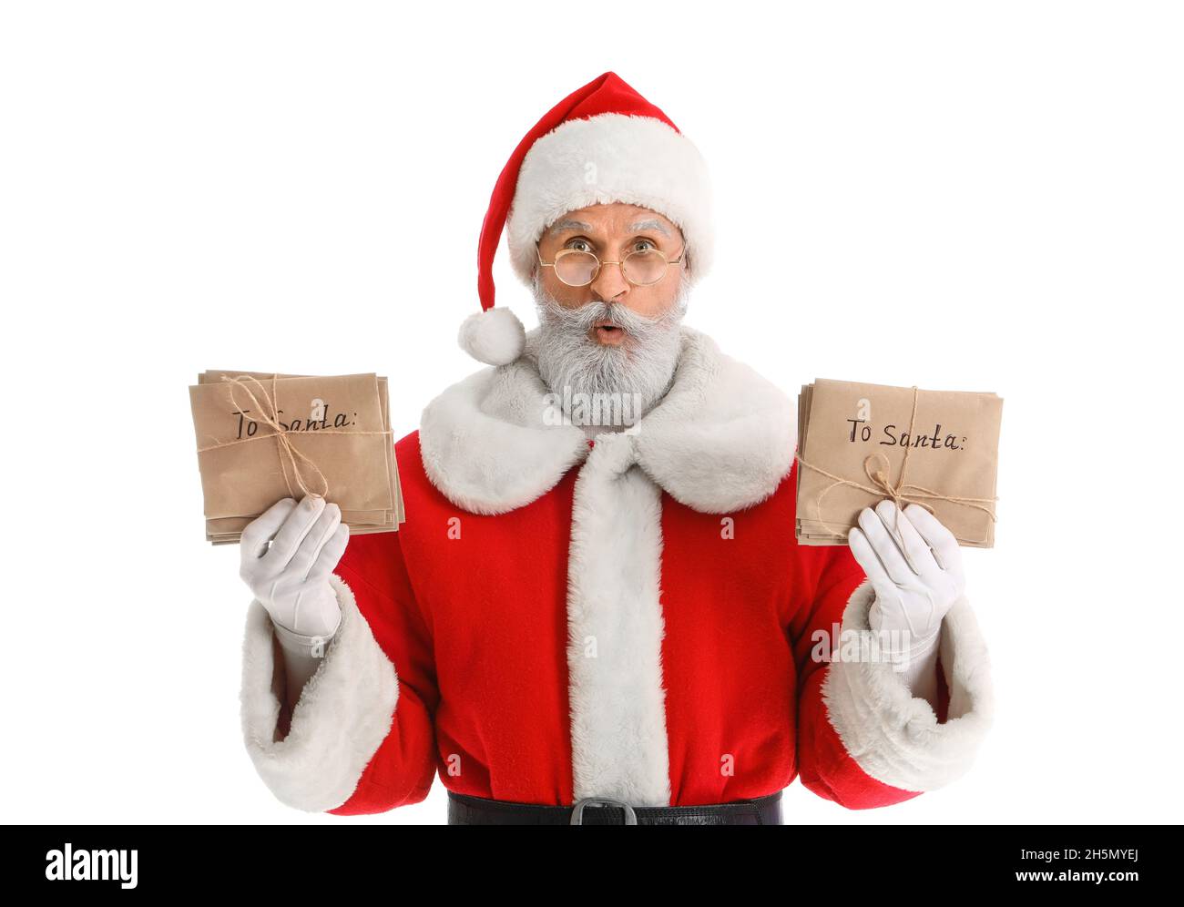 Surprised Santa Claus with letters on white background Stock Photo - Alamy
