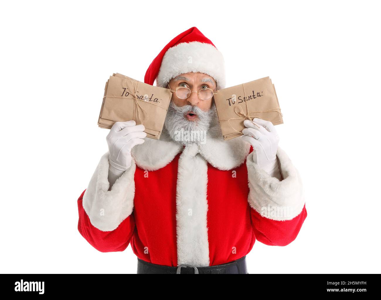 Surprised Santa Claus with letters on white background Stock Photo - Alamy