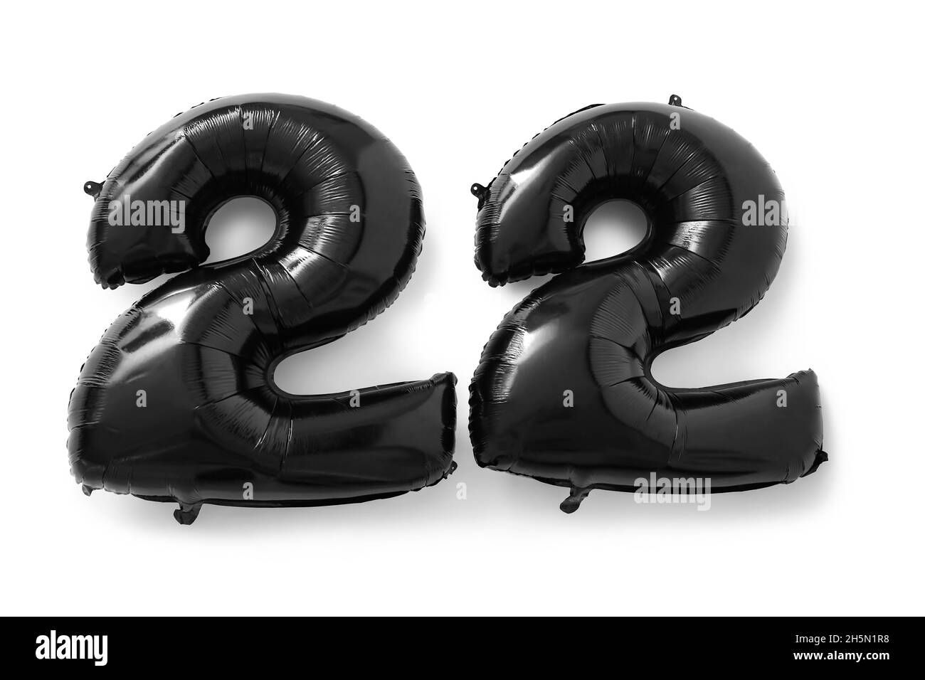 Figure 22 made of black balloons on white background Stock Photo - Alamy