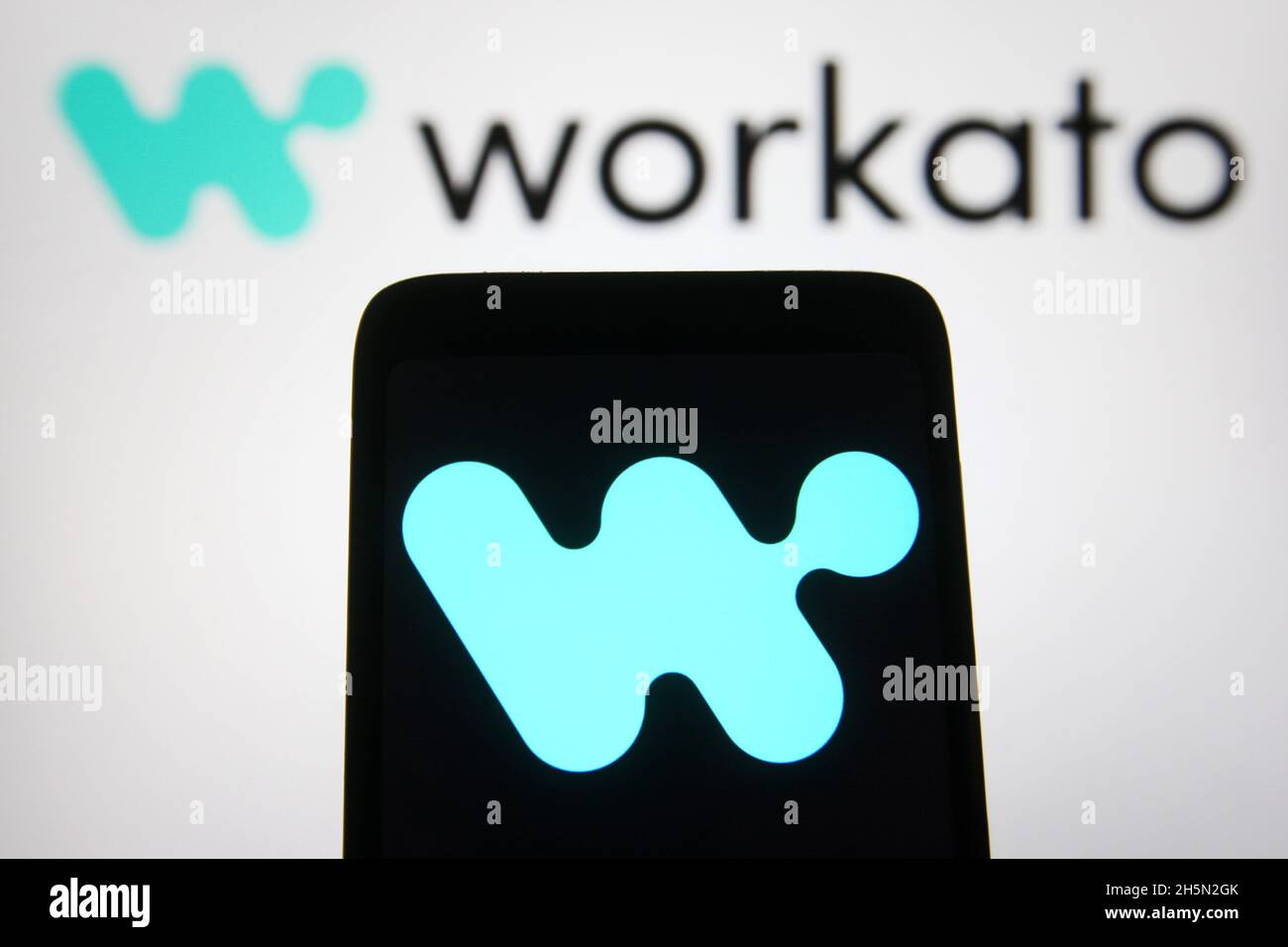 In this photo illustration, a Workato logo is seen on a smartphone and ...