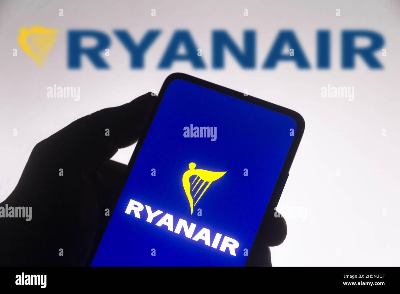 In this photo illustration the Ryanair logo seen displayed on a ...