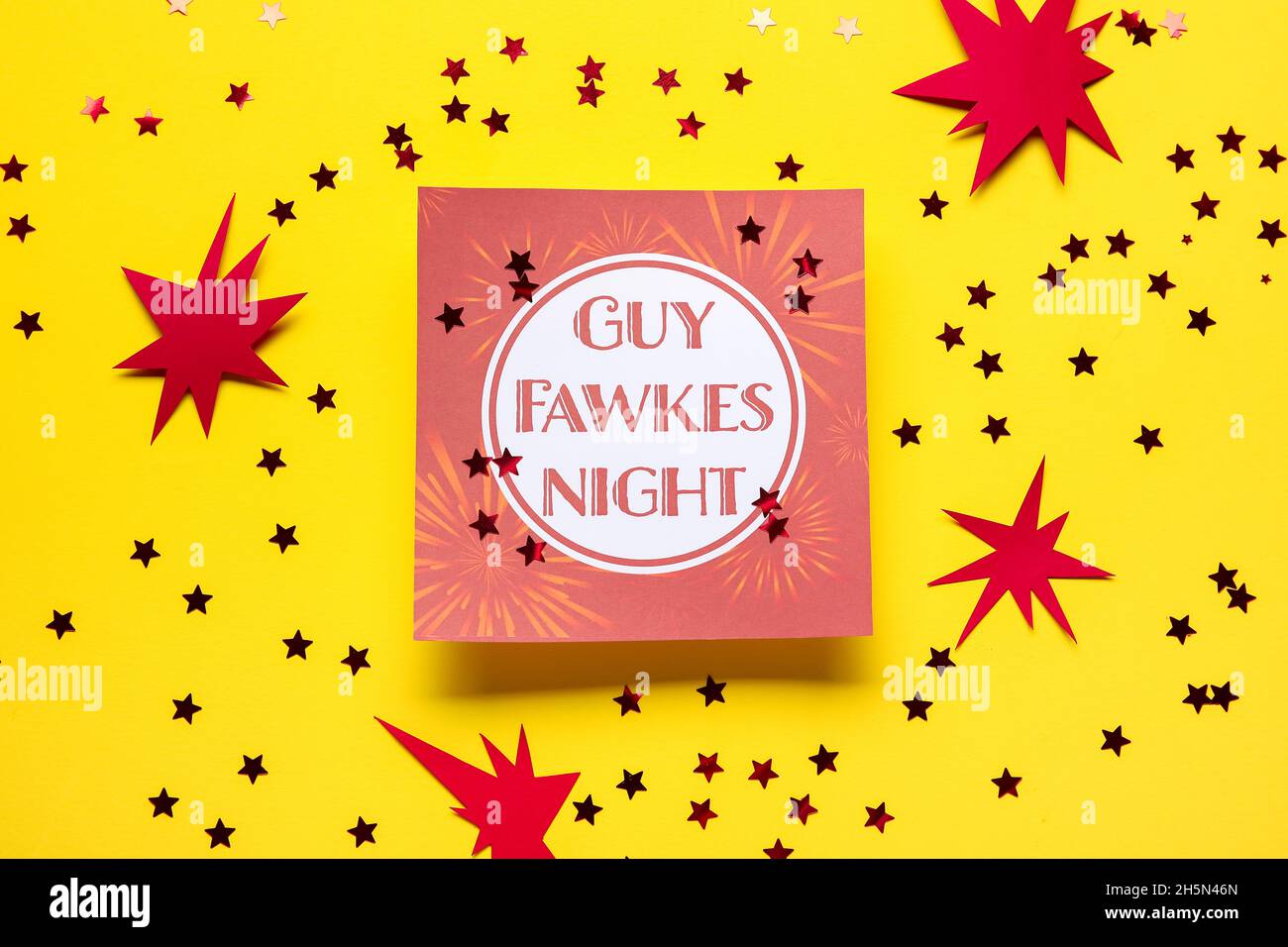Greeting card for Guy Fawkes night and confetti on yellow background ...