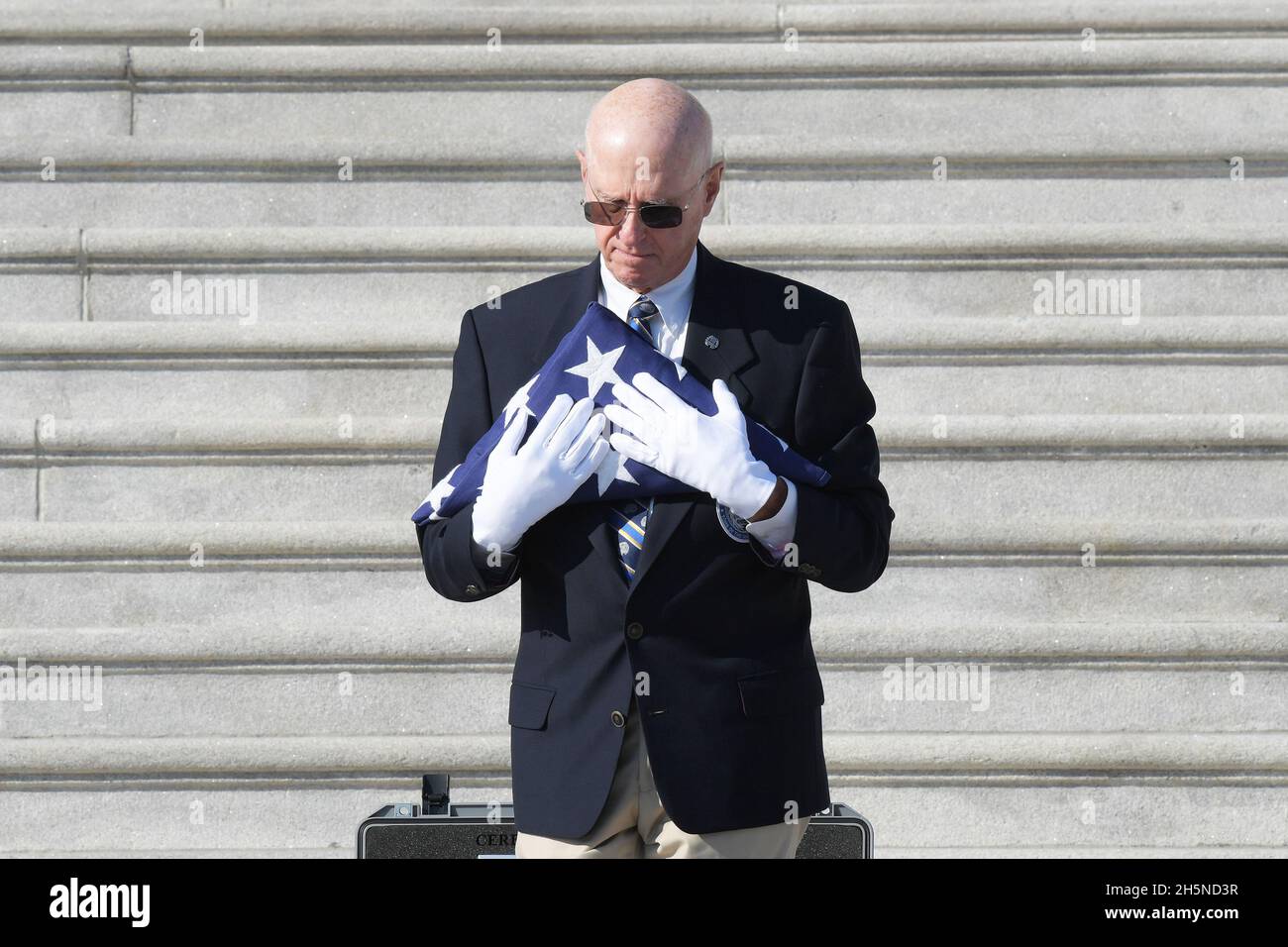 Former Sentinel folds the US Flag during a Ceremony for the 100th ...