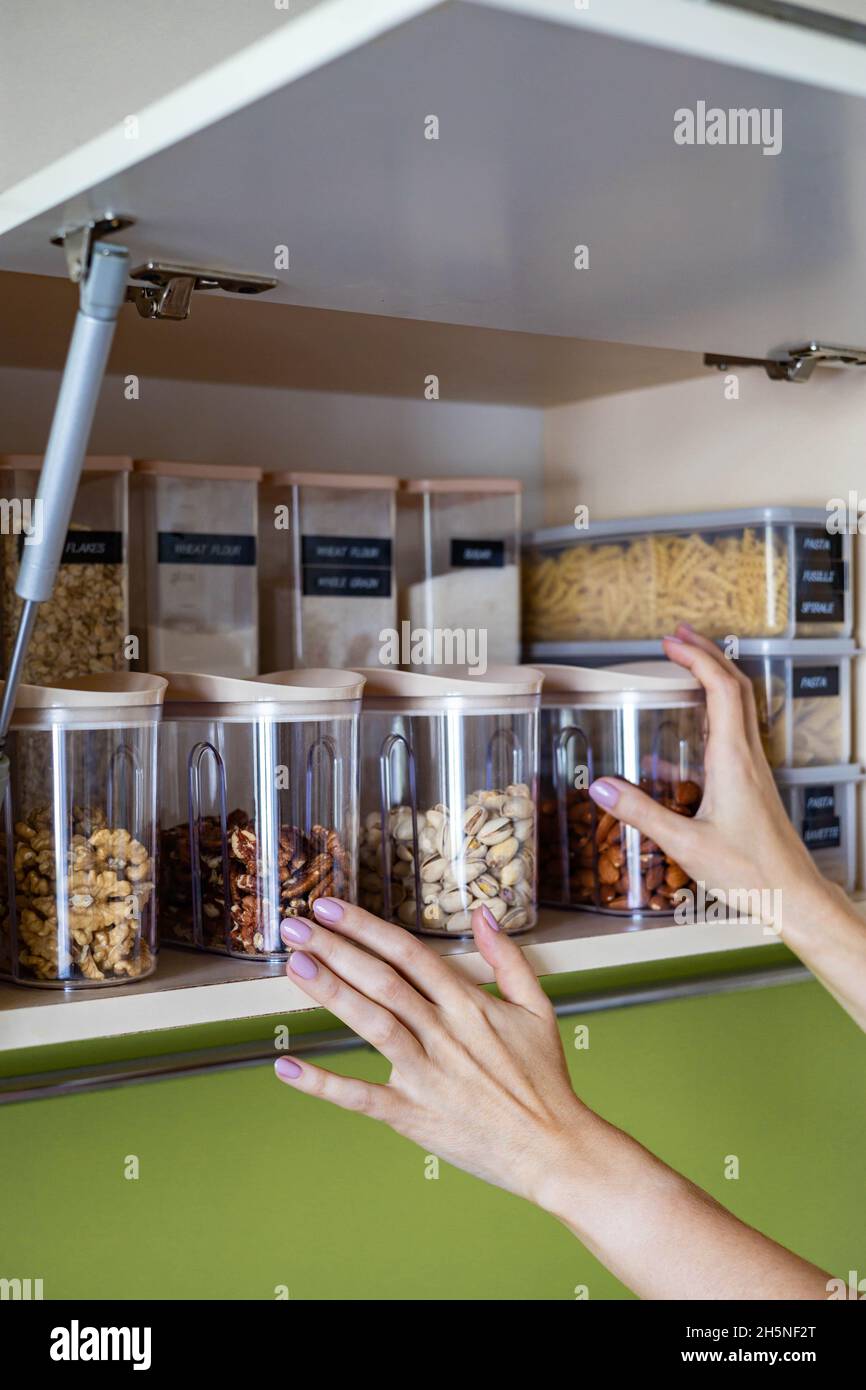 Domestic healthy vegetarian dry food storage organization on shelf at ...