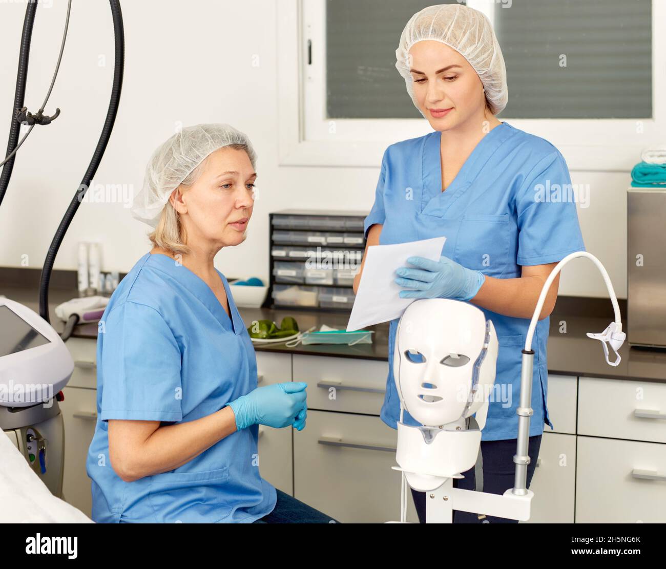 Female cosmetologists at the medical center Stock Photo - Alamy