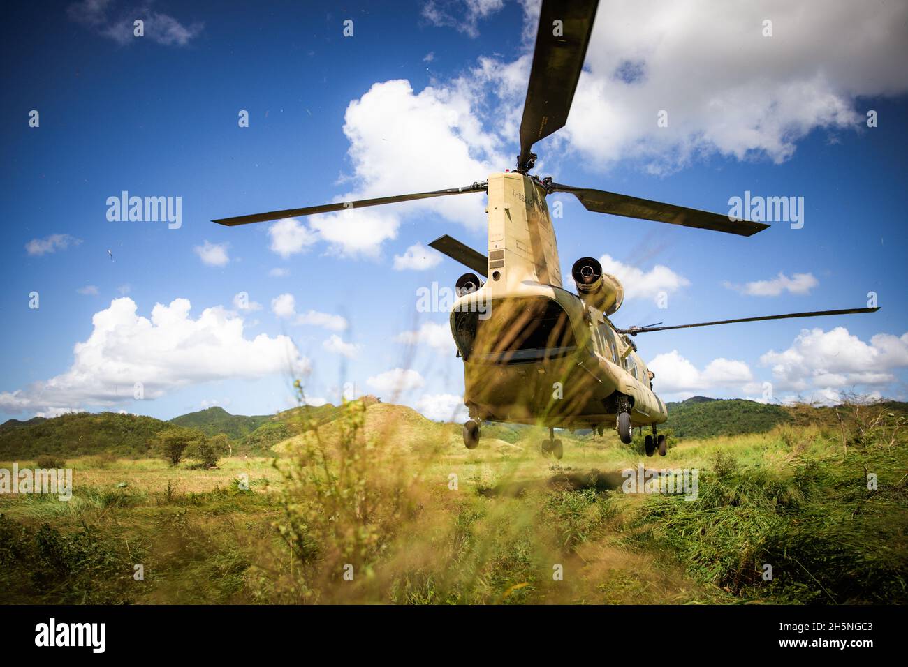 A CH-47 Chinook helicopter takes off after unloading U.S. Army Reserve ...