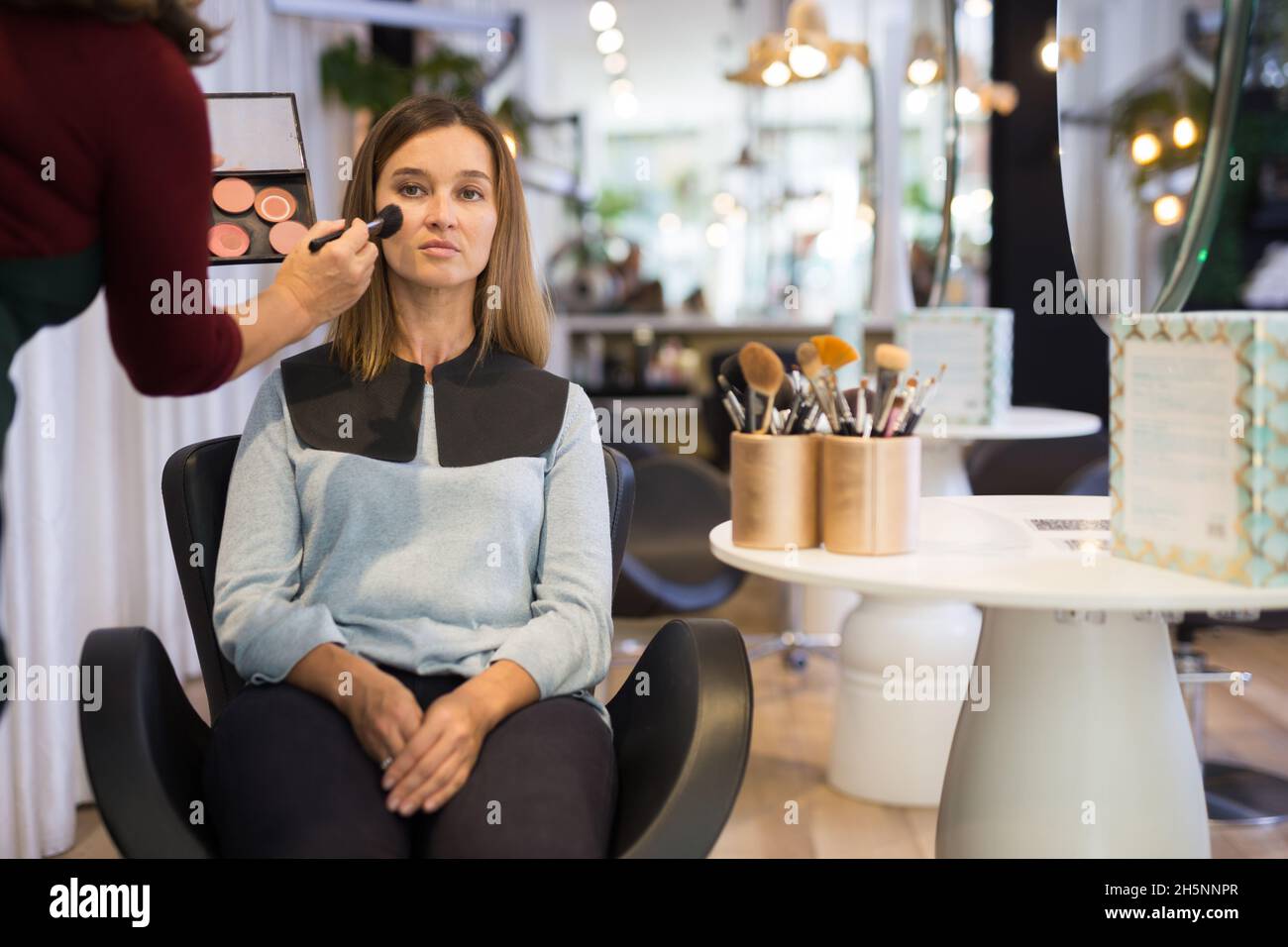 Woman blushing hands face hi-res stock photography and images - Alamy