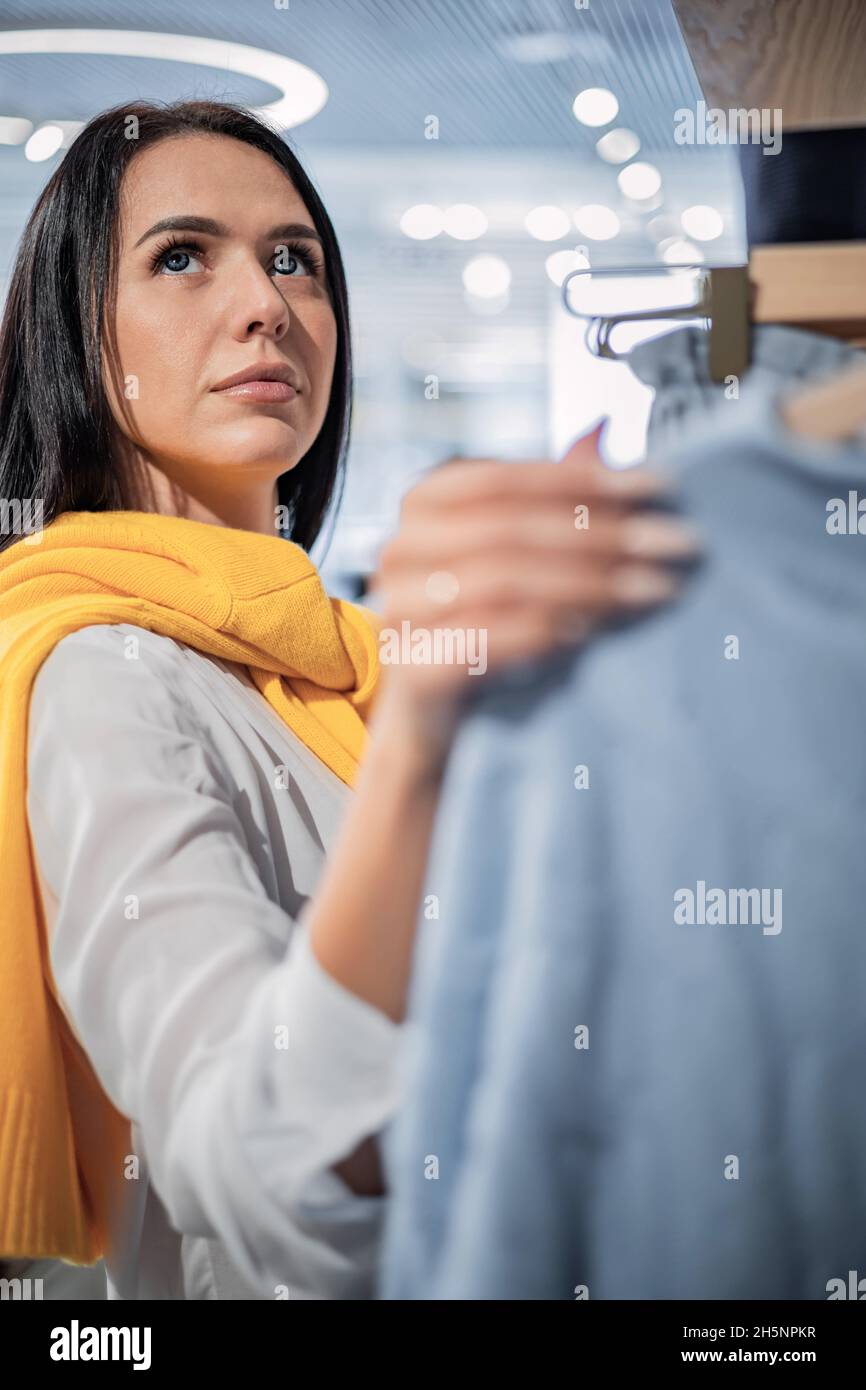 Grabbing clothing hi-res stock photography and images - Alamy