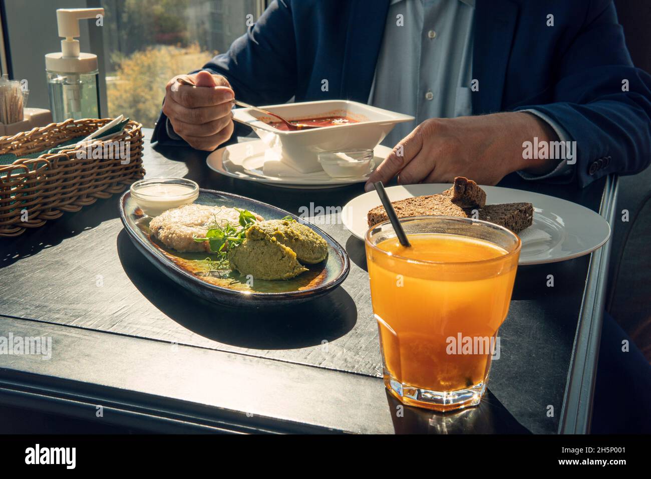 Black man eating lunch in hi-res stock photography and images - Alamy
