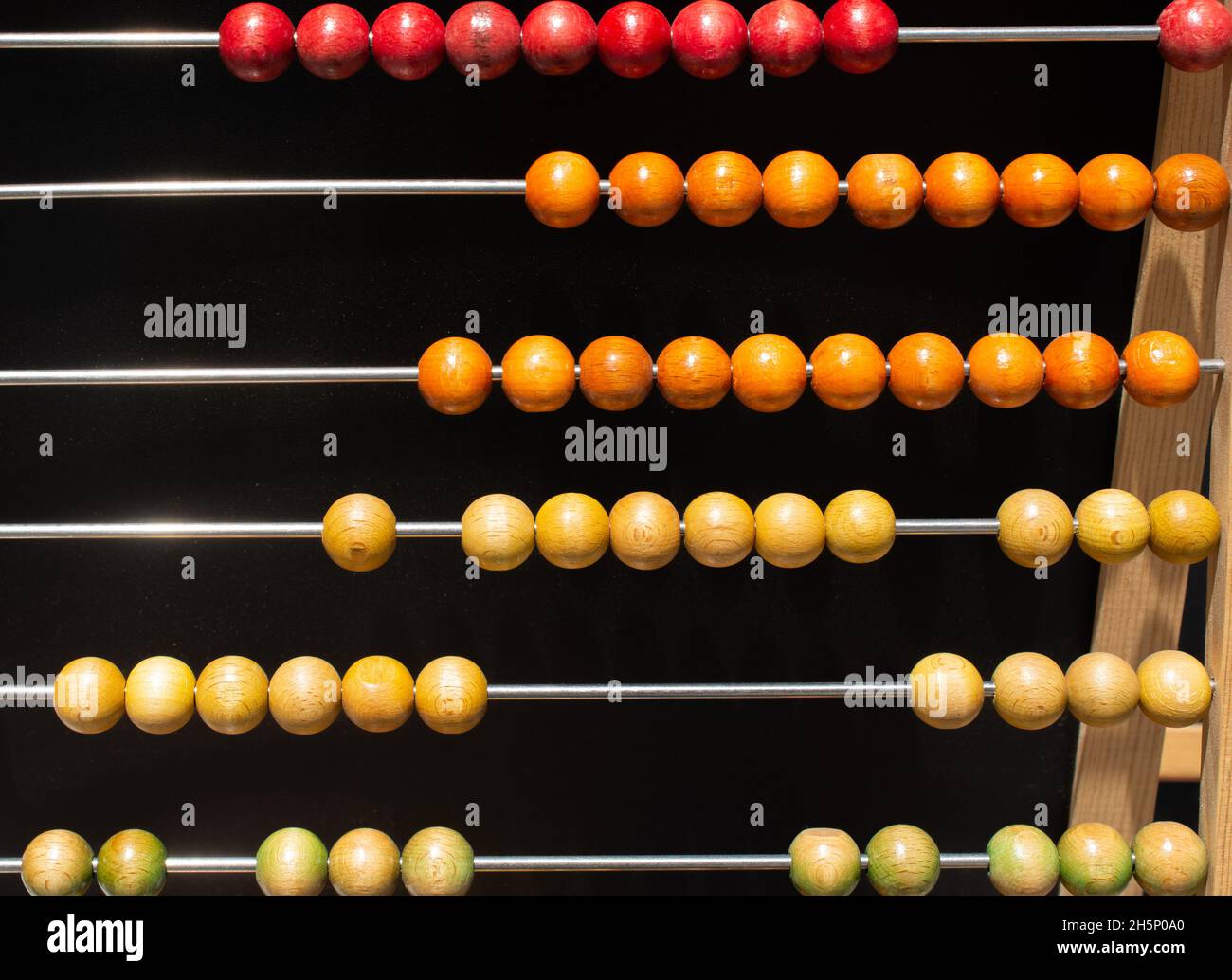 Colorful wooden rainbow abacus for number calculation Stock Photo - Alamy