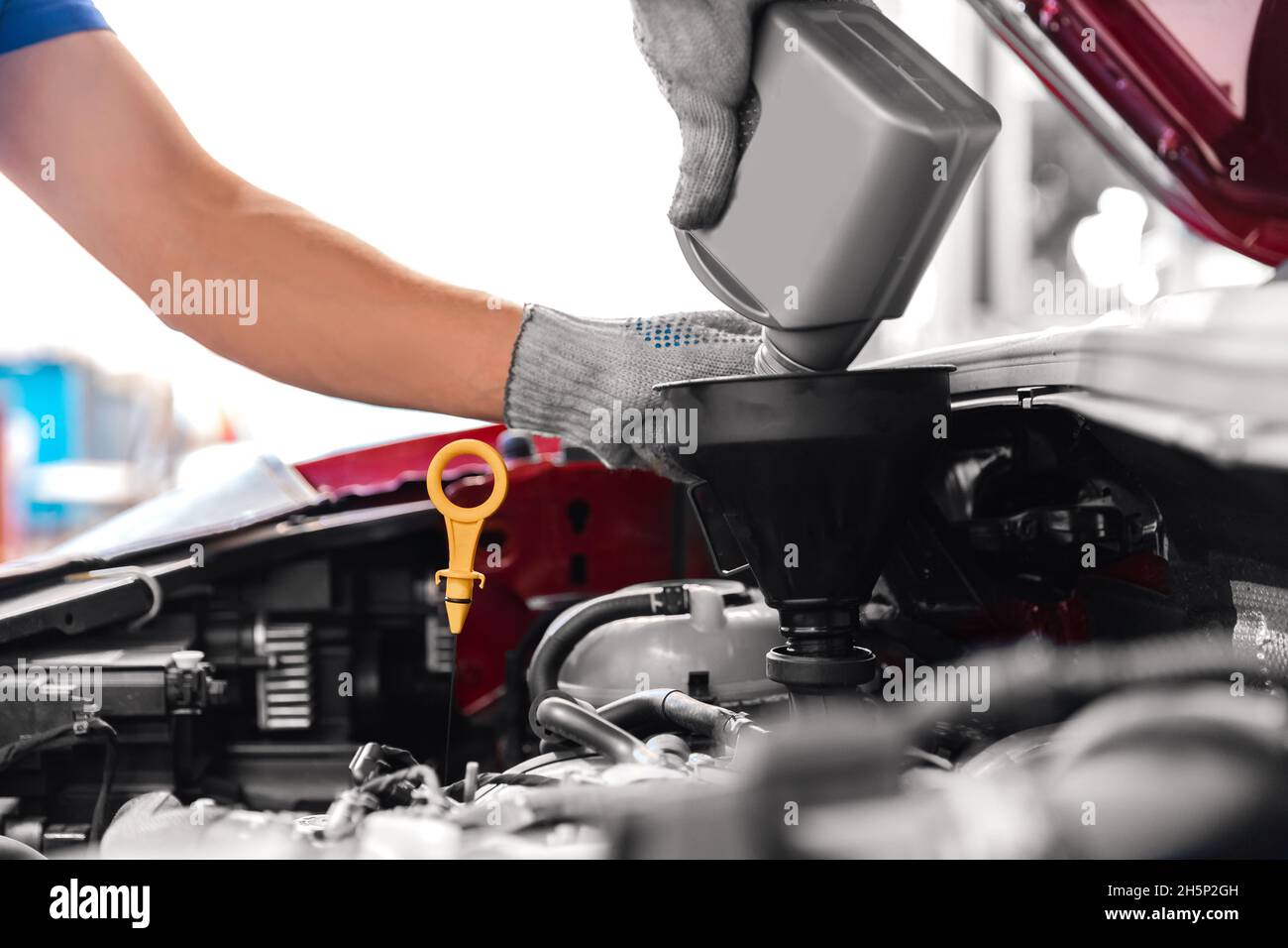 Mechanic working on checking and service car in workshop garage, engine ...