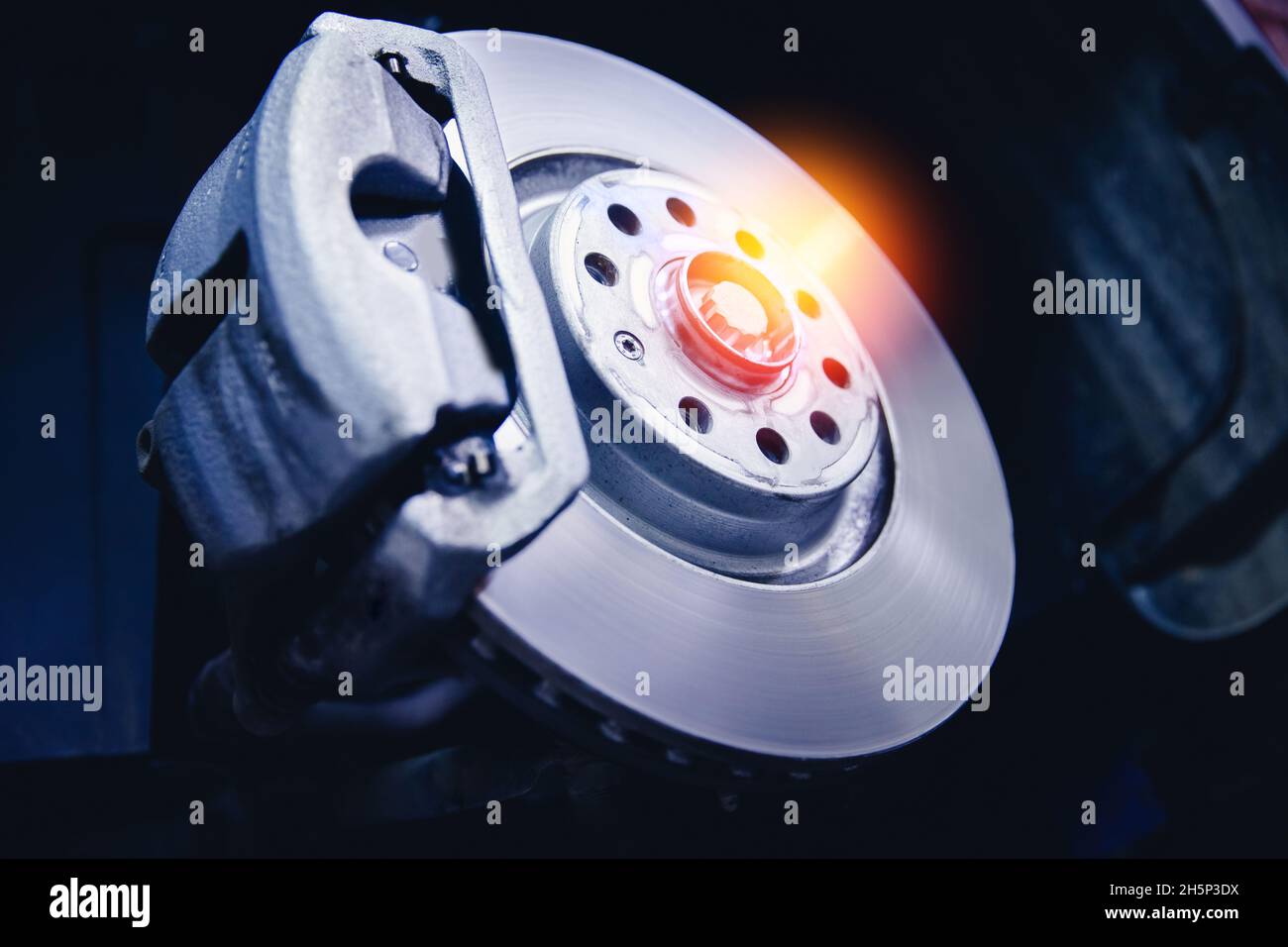 Closeup steel brake disk and detail of wheel hub with sunlight. Concept ...