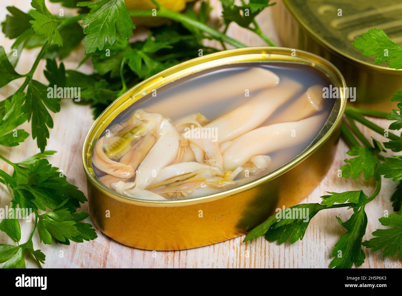 Preserved natural ensis with herbs and lemon Stock Photo - Alamy