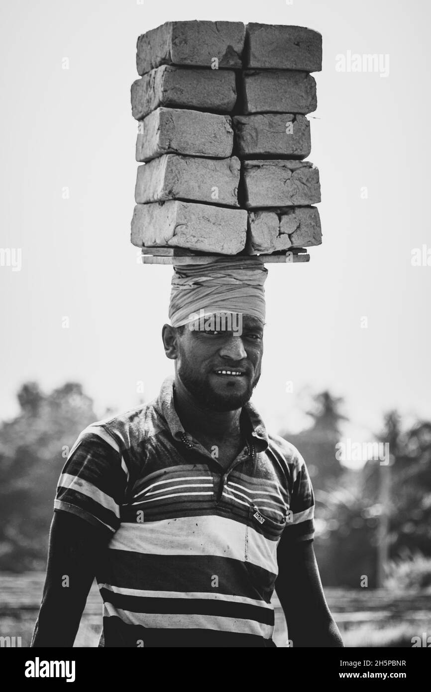 Adult man smiling while working Stock Photo - Alamy