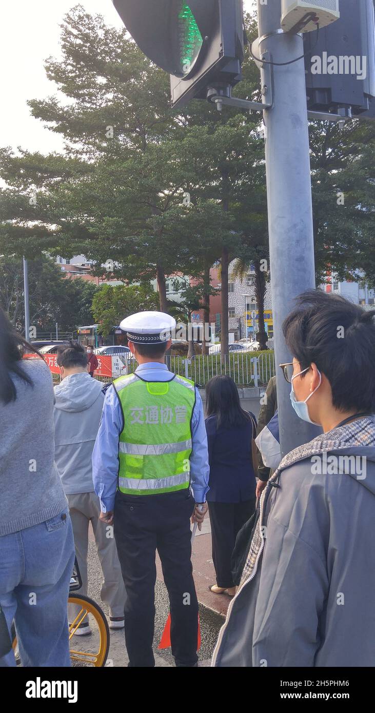 Shenzhen, China: traffic controllers maintain traffic order at traffic ...