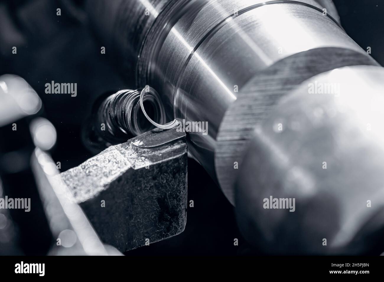 Process CNC lathe machine cutting metal. Modern industrial iron ...