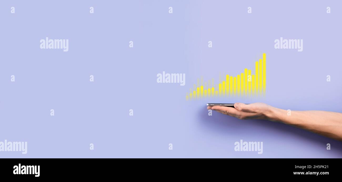 Male hand holding graph icon.checking analyzing sales data growth graph ...