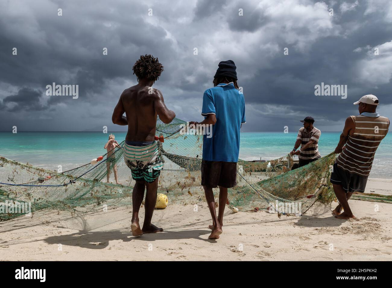 Barbados beach man caribbean fishing hi-res stock photography and ...