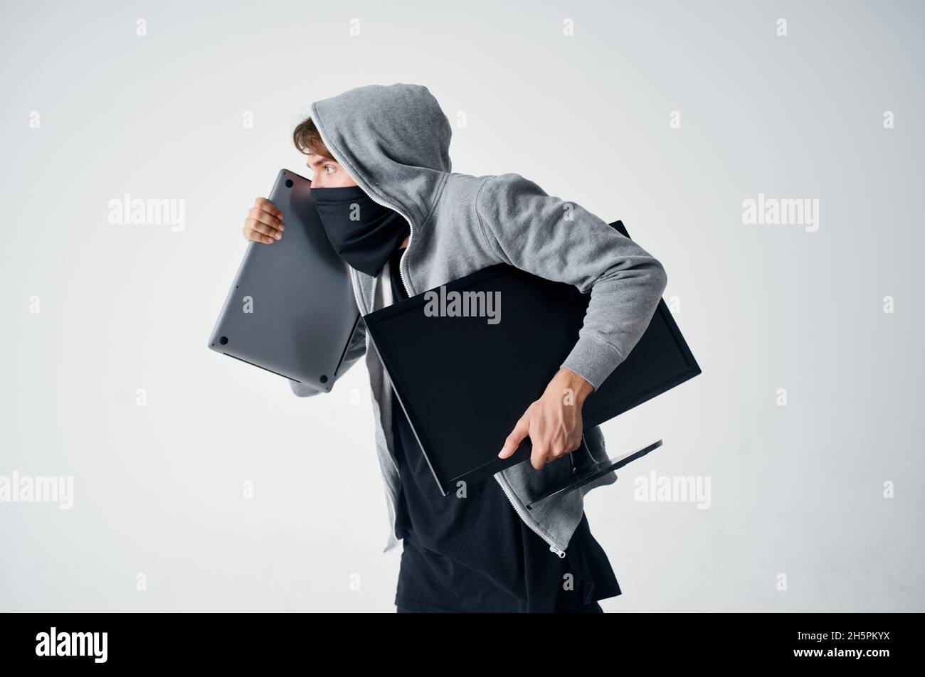 masked man hooded head hacking technology security isolated background Stock Photo - Alamy