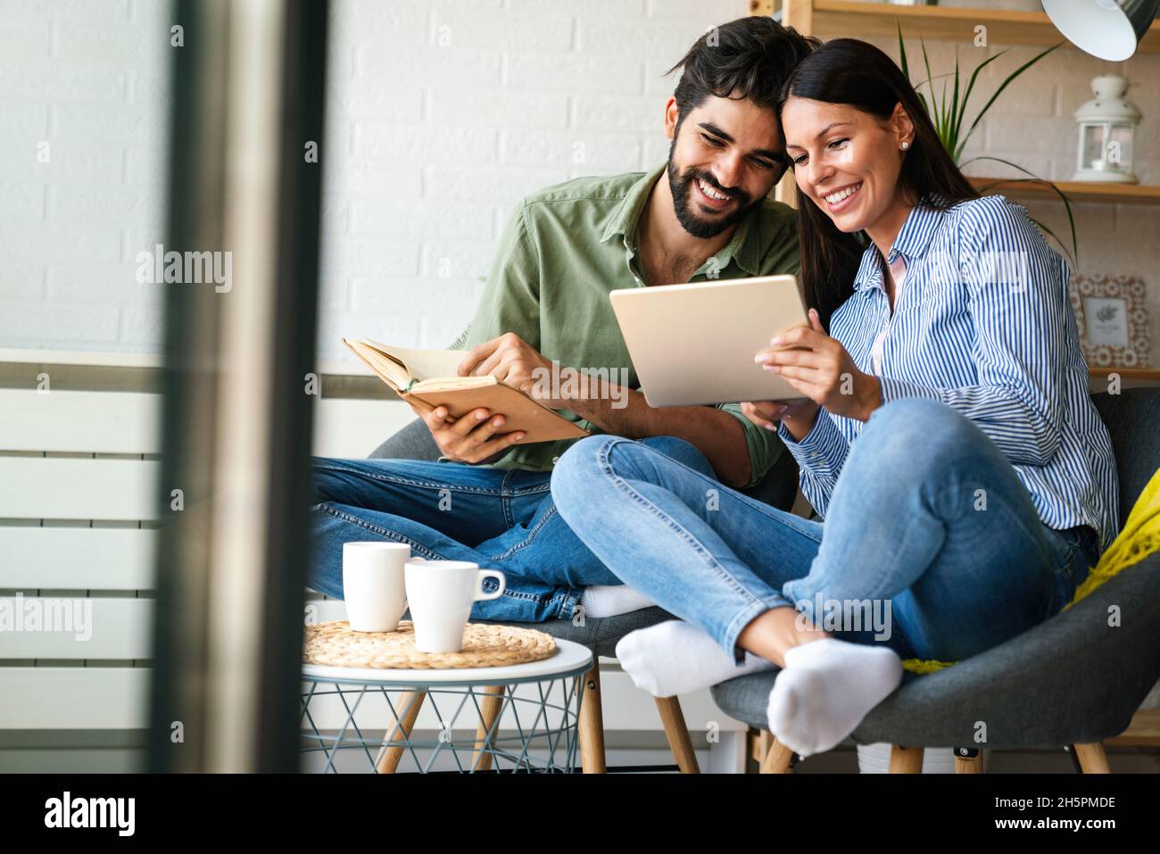 Free time together. Happy couple is spending weekend together at home ...