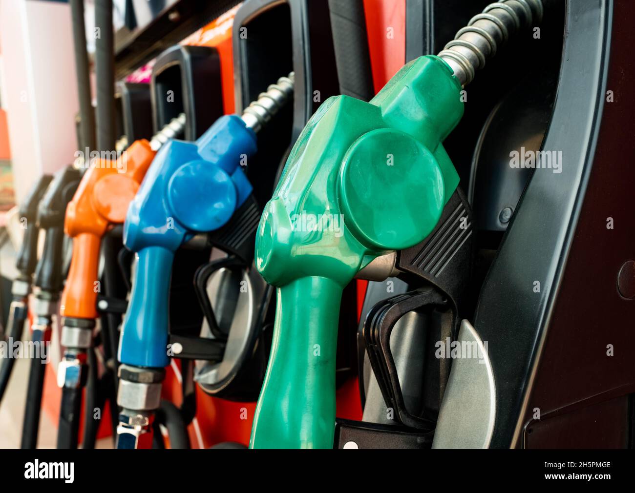 Petrol pump filling fuel nozzle in gas station. Fuel dispenser machine ...