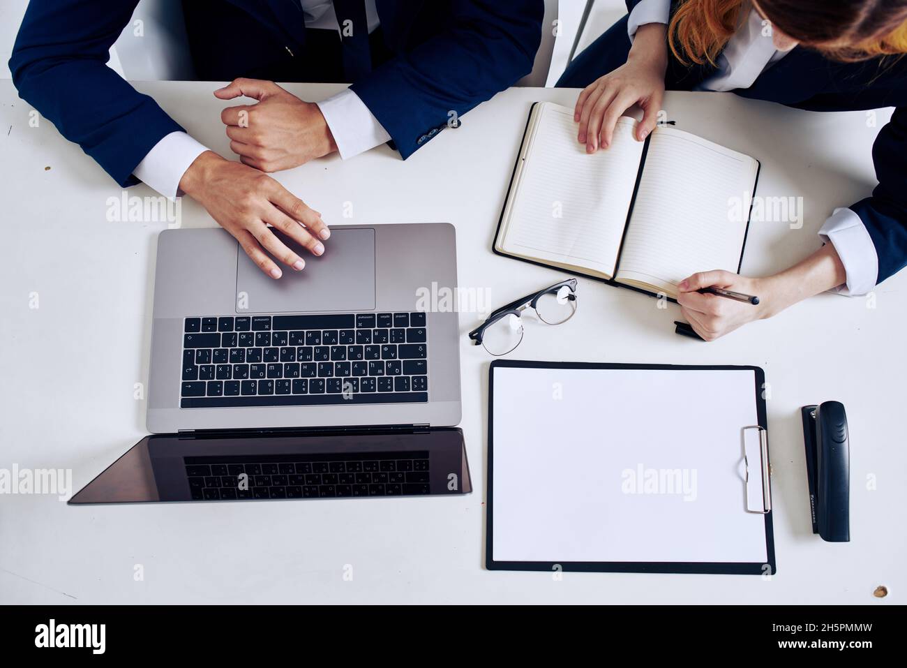 colleagues teamwork in the office with laptop technology Stock Photo ...