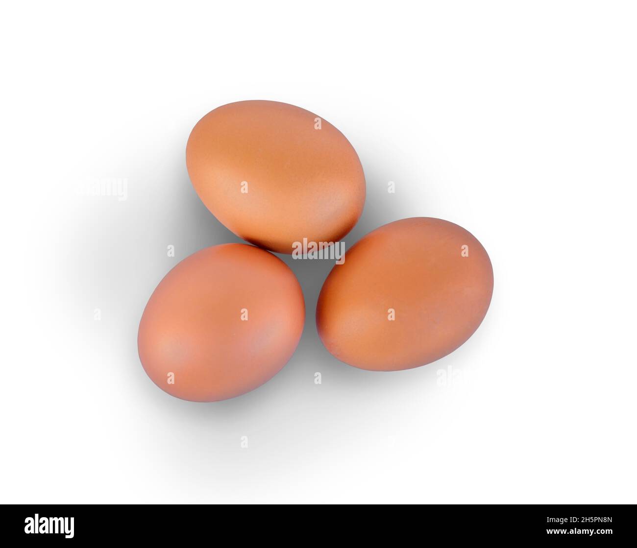 Three eggs isolated on white background Stock Photo - Alamy