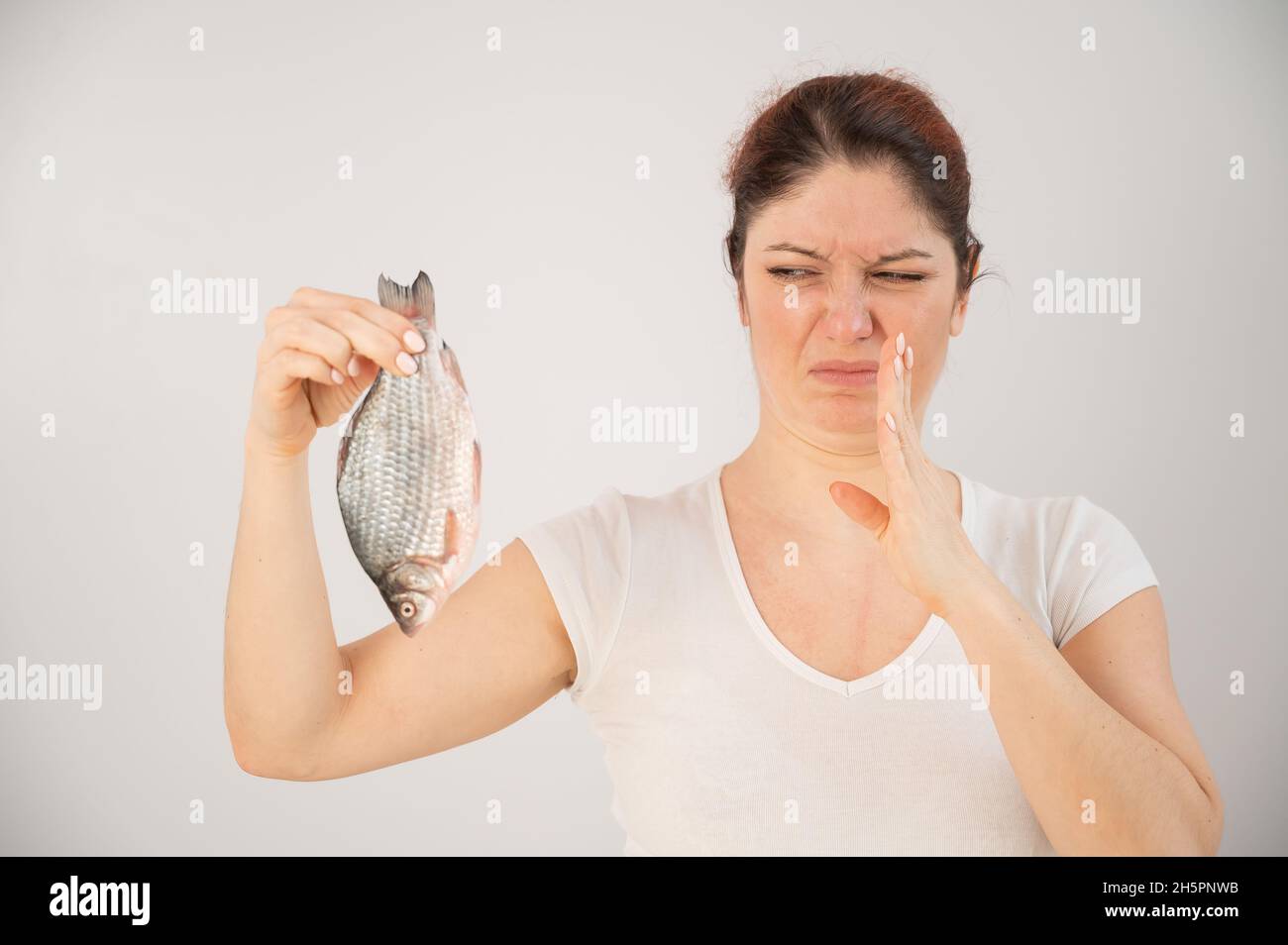 Girl with dead fish hi-res stock photography and images - Alamy