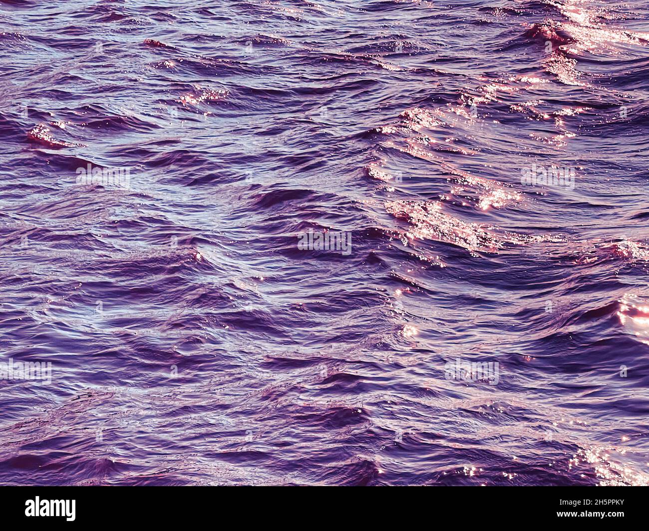 Sea, texture and coastal nature concept. Ocean water at sunset as ...