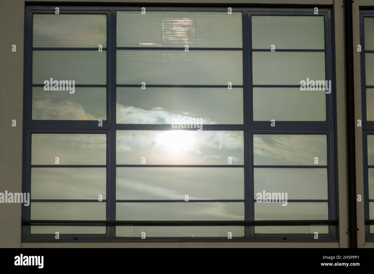 House: building has a mirrored glass window on the facade that reflects ...