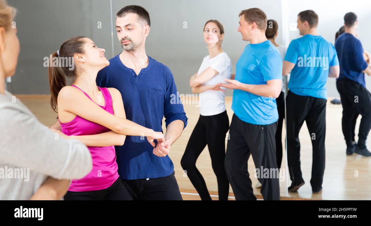 Young couple practicing active dance in pair Stock Photo - Alamy