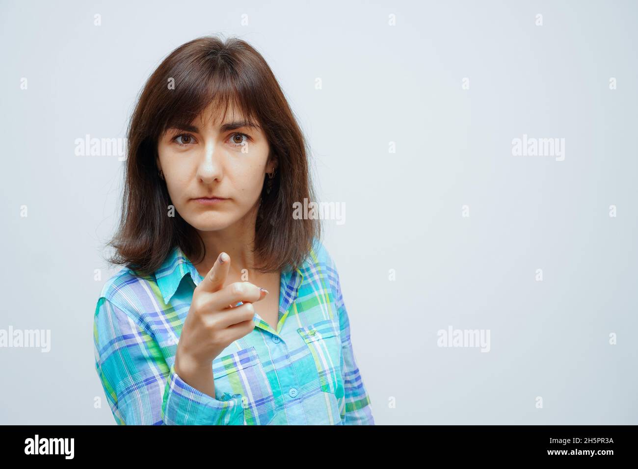 Angry beautiful woman point camera hi-res stock photography and images ...