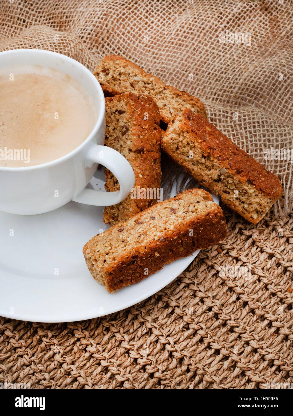 coffee and fresh traditional South African Rusks on rustic table Stock ...