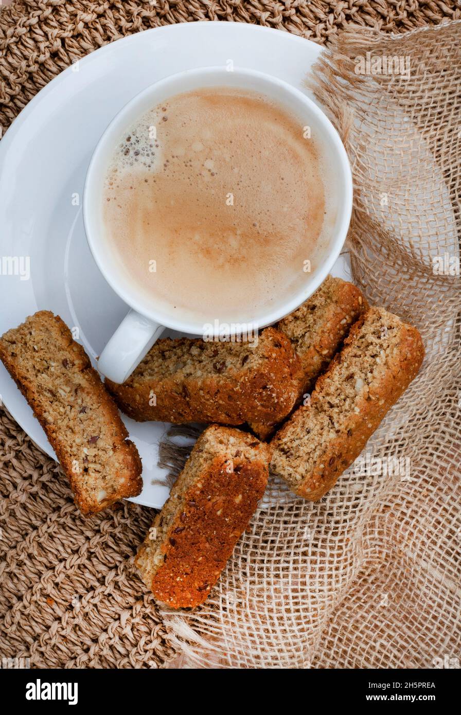 coffee and fresh traditional South African Rusks on rustic table Stock ...