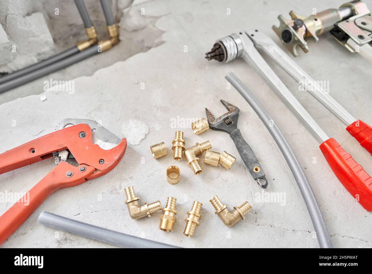 connection heating pipes to white Radiator in a new apartment under ...